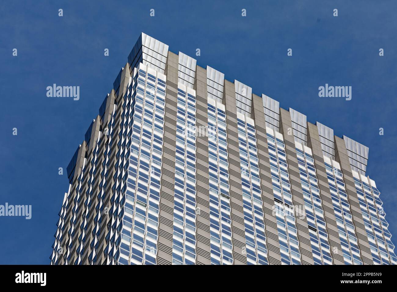 Unusual two-pane windows and pre-cast concrete panels create arresting ...
