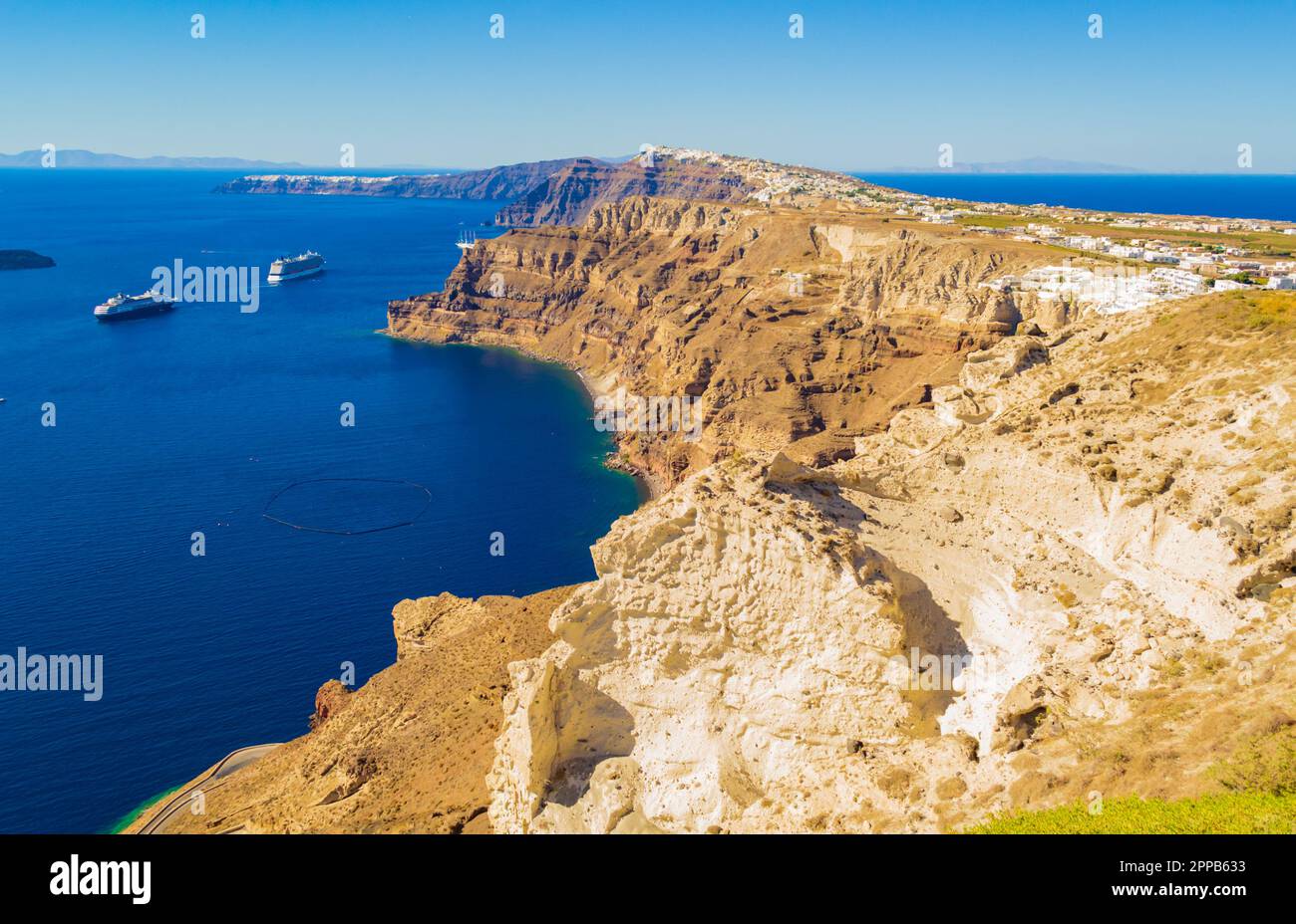 Dramatic picturesque Santorini island steep shoreline perspective ...