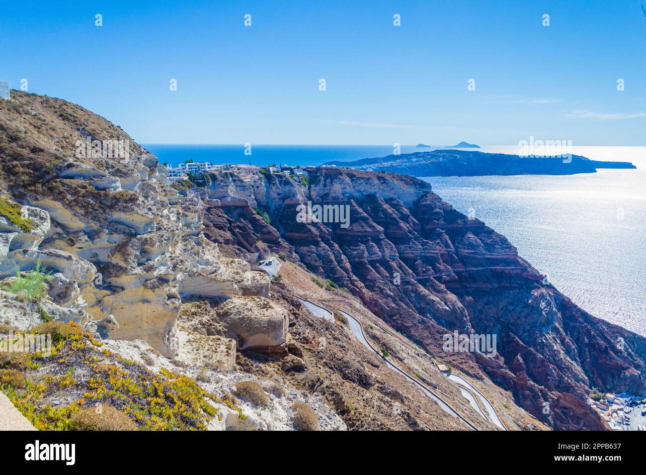 Dramatic picturesque Santorini island steep shoreline perspective ...