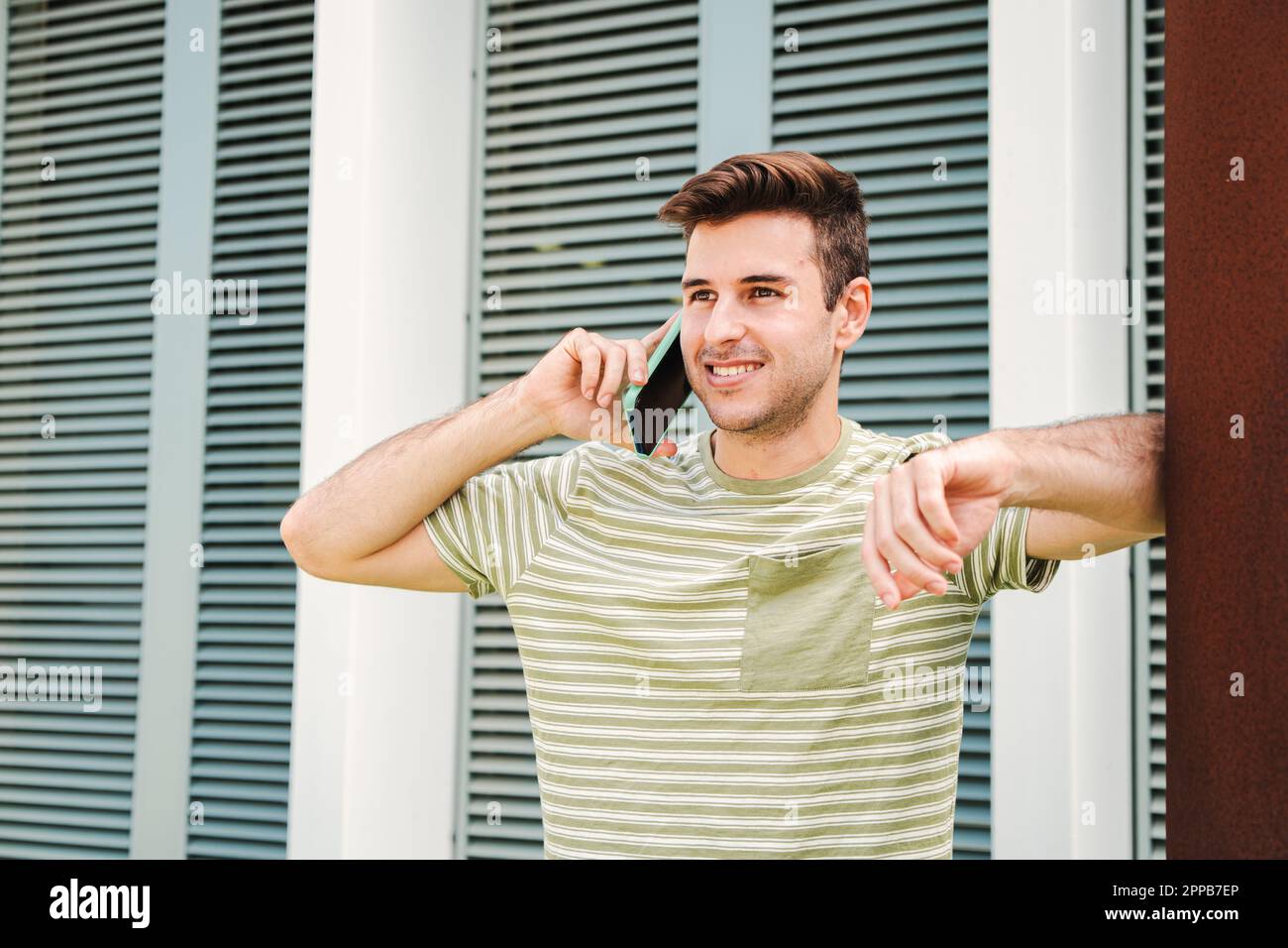 Cheerful guy speaking friend using hi-res stock photography and images ...