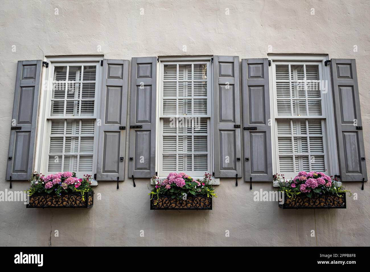 Close up of the color windows of a colonial era home in Charleston ...