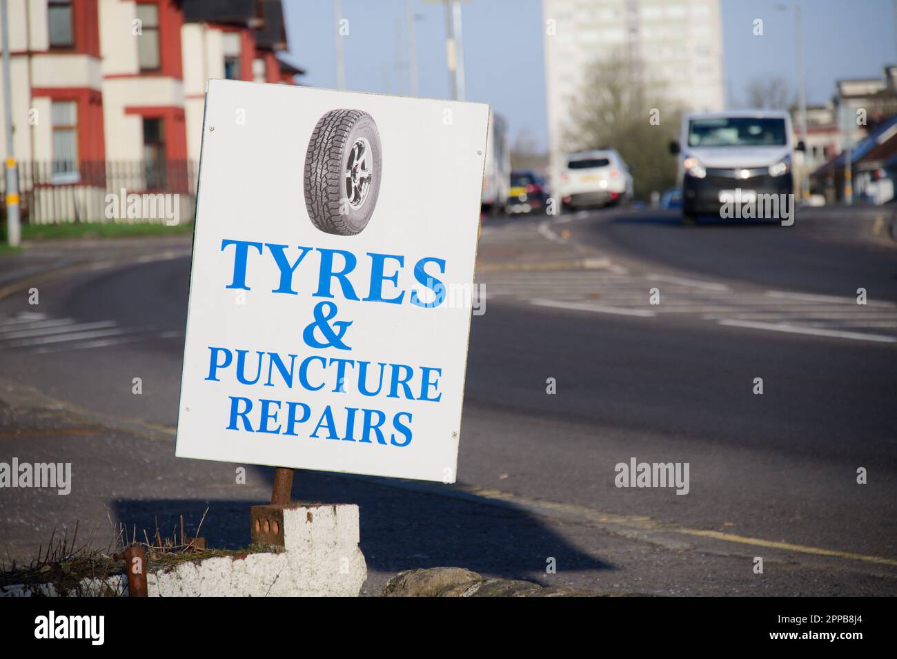 Tyre and puncture repairs sign outside a garage Stock Photo - Alamy