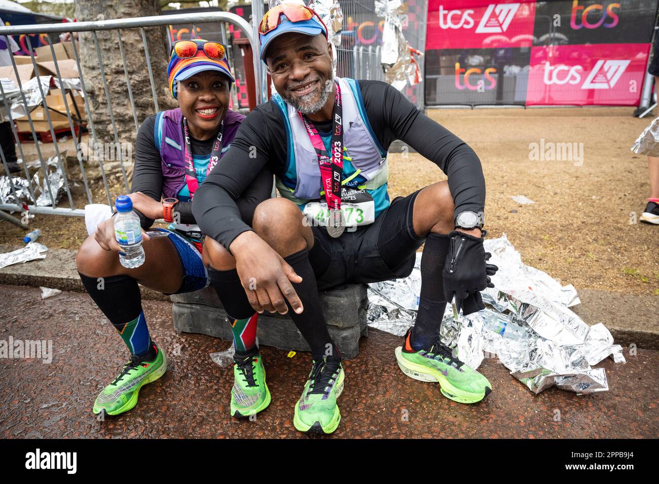 London, UK. 23 April 2023. Runners with their medals at the finish of ...