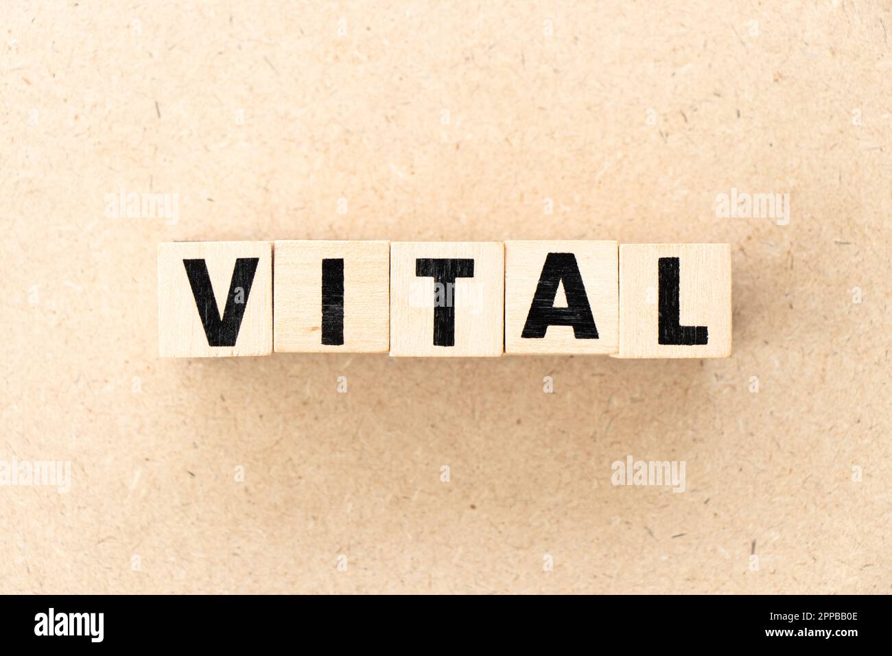 Alphabet letter block in word vital on wood background Stock Photo - Alamy