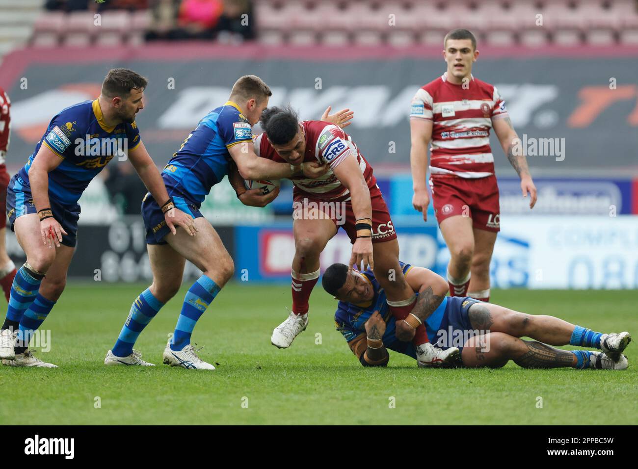 Wigan Warriors’ Patrick Mago is tackled during the Betfred Super League ...