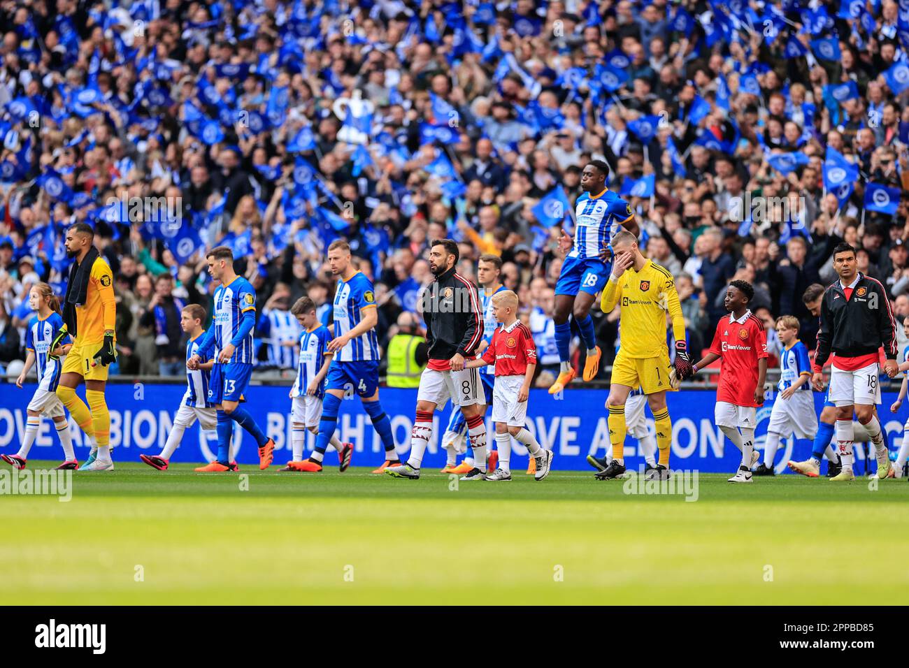 The teams walk out at the start of the match hi-res stock photography ...