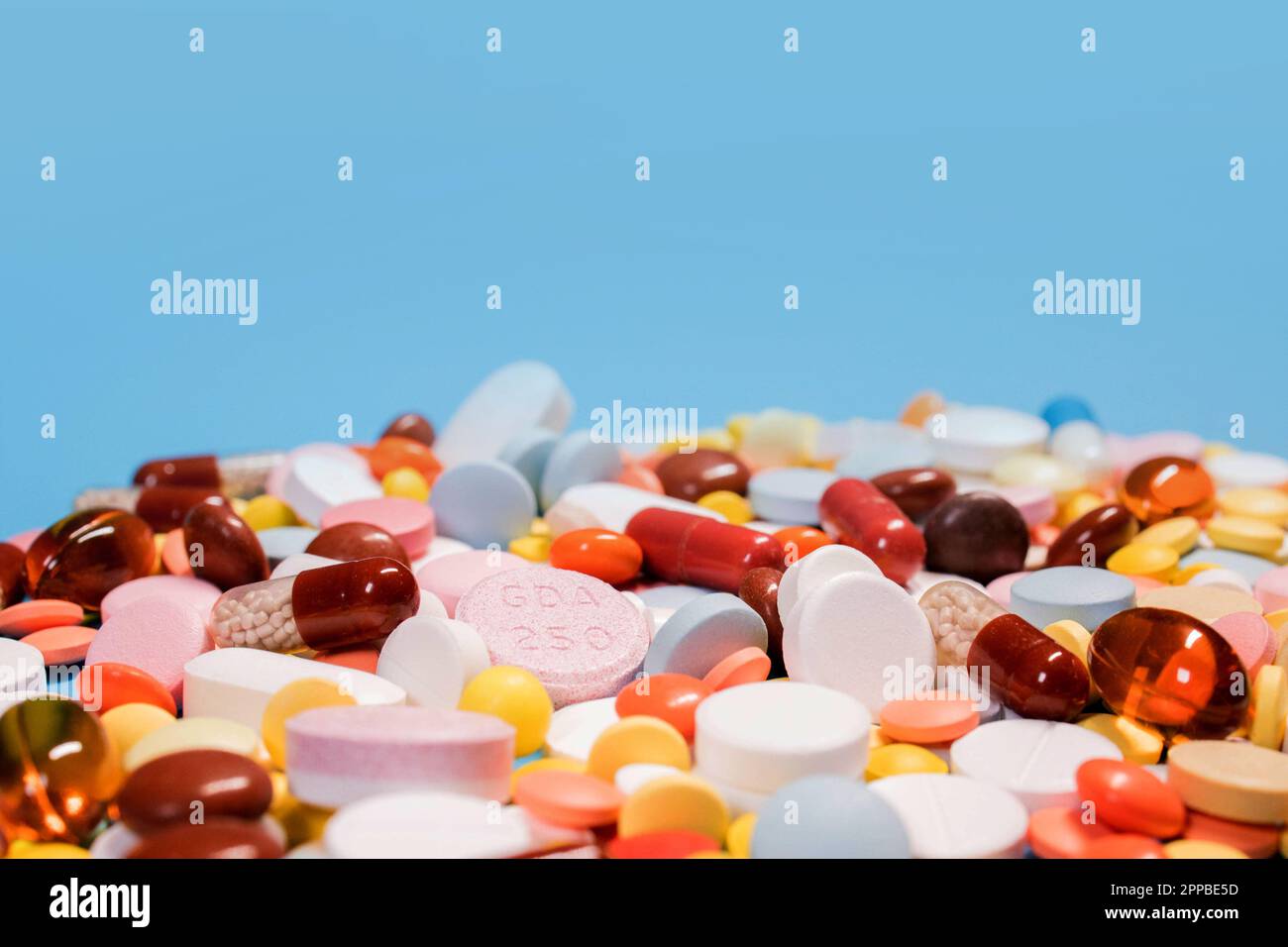 Many colorful different medicines and pills on top. The concept of ...