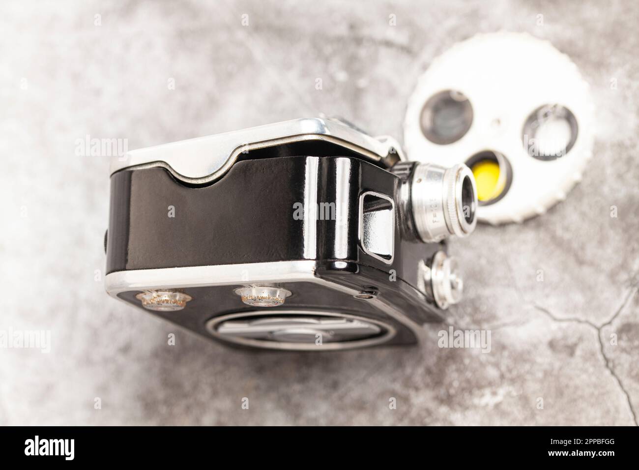Vintage movie camera iwith filters on a gray background Stock Photo - Alamy