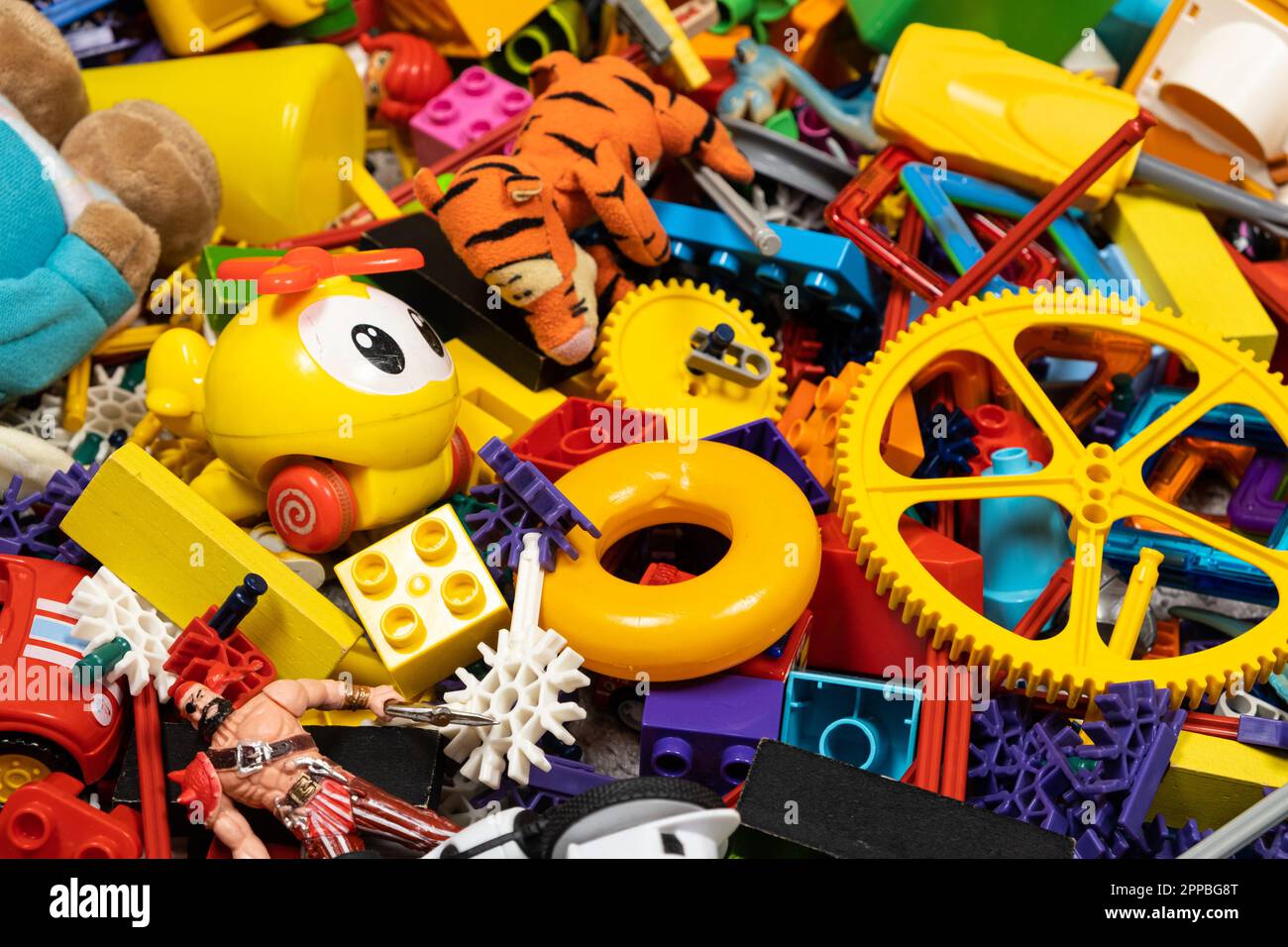 An abundance of toys in the children's room, a lot of plastic multi ...