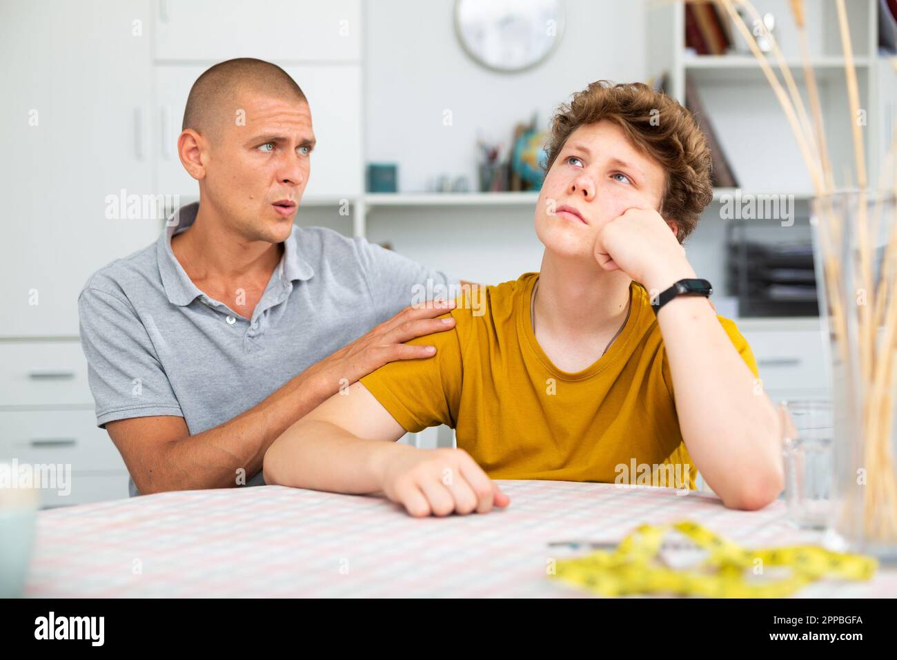 Father comforting his son Stock Photo - Alamy