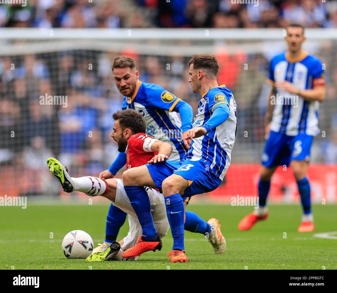 Bruno Fernandes #8 of Manchester United is fouled by Pascal Gros #13 of ...