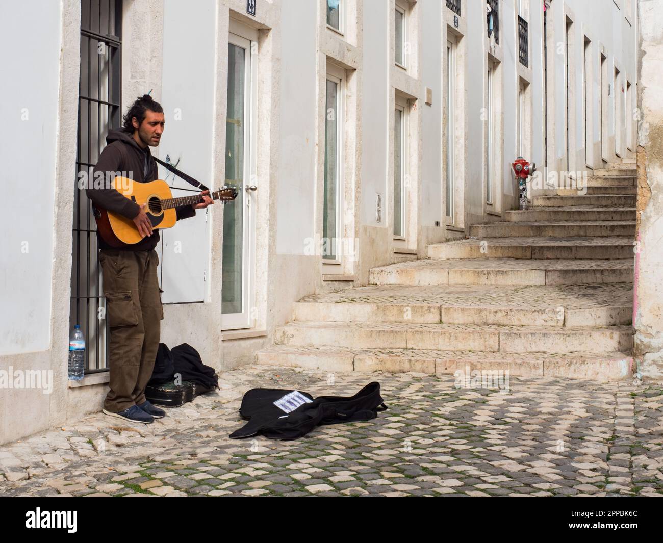 Lisbon, Portugal - Jan, 2019: Man singing, playing a guitar and ...