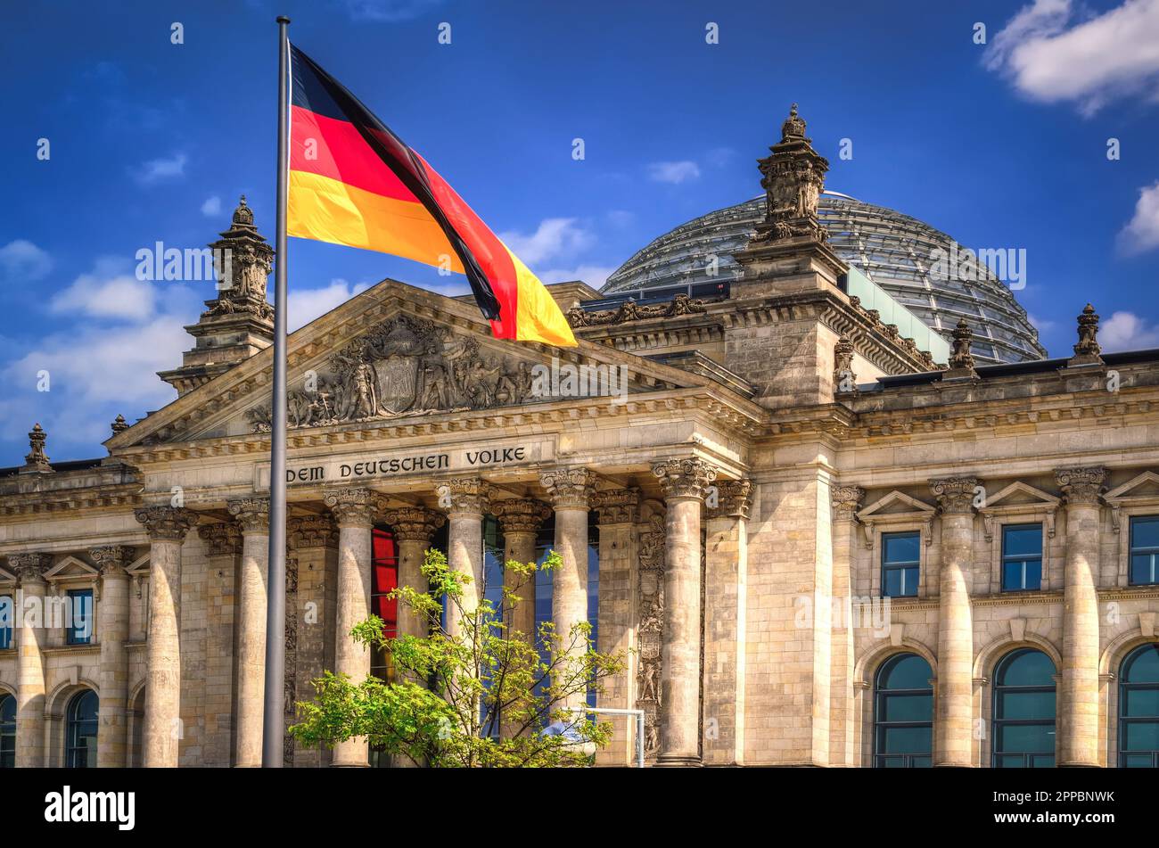 The Reichstag building in Berlin City. Flag of the Federal Republic of ...
