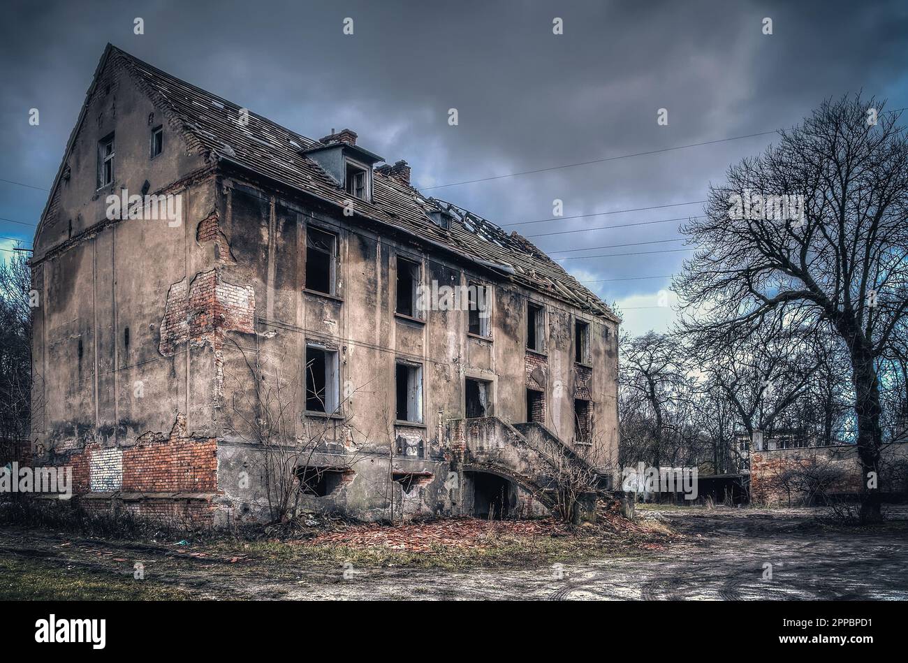 Old ruined building in a dark scenery. Left collapsing house, the ...
