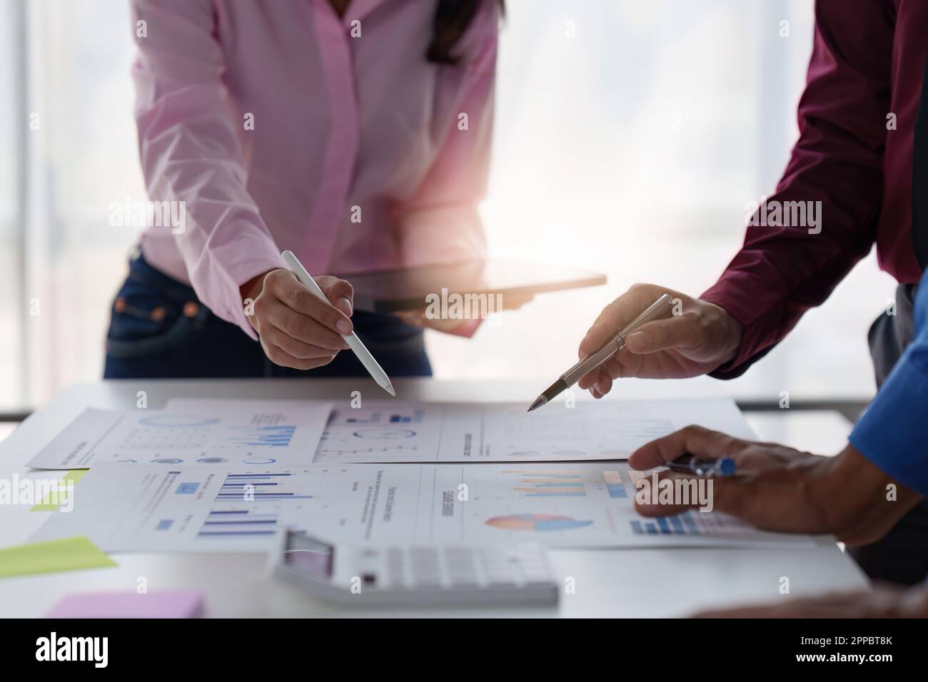 Close up of Diverse colleagues gather brainstorm discuss financial ...