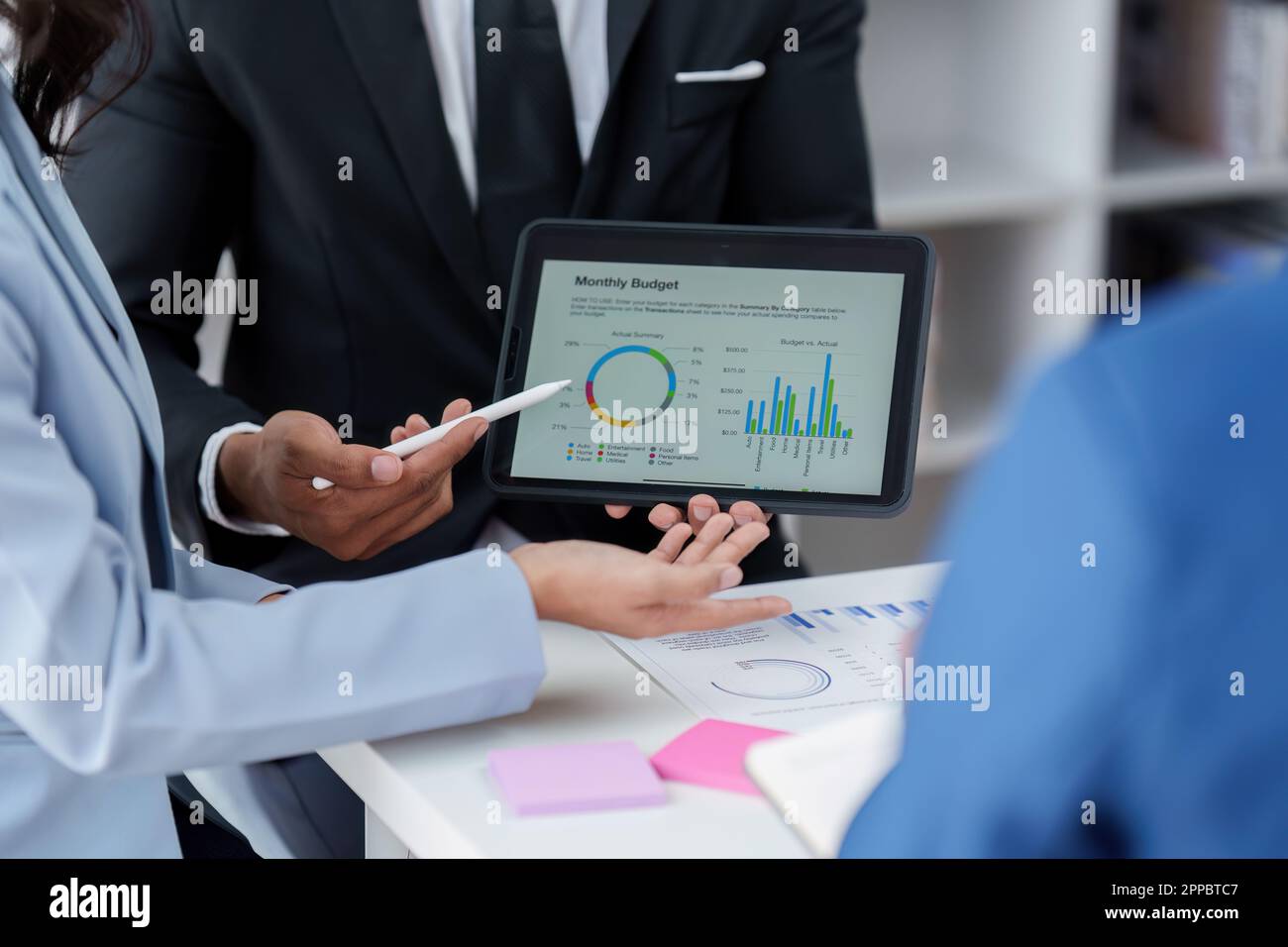 Close up of Diverse colleagues gather brainstorm discuss financial ...