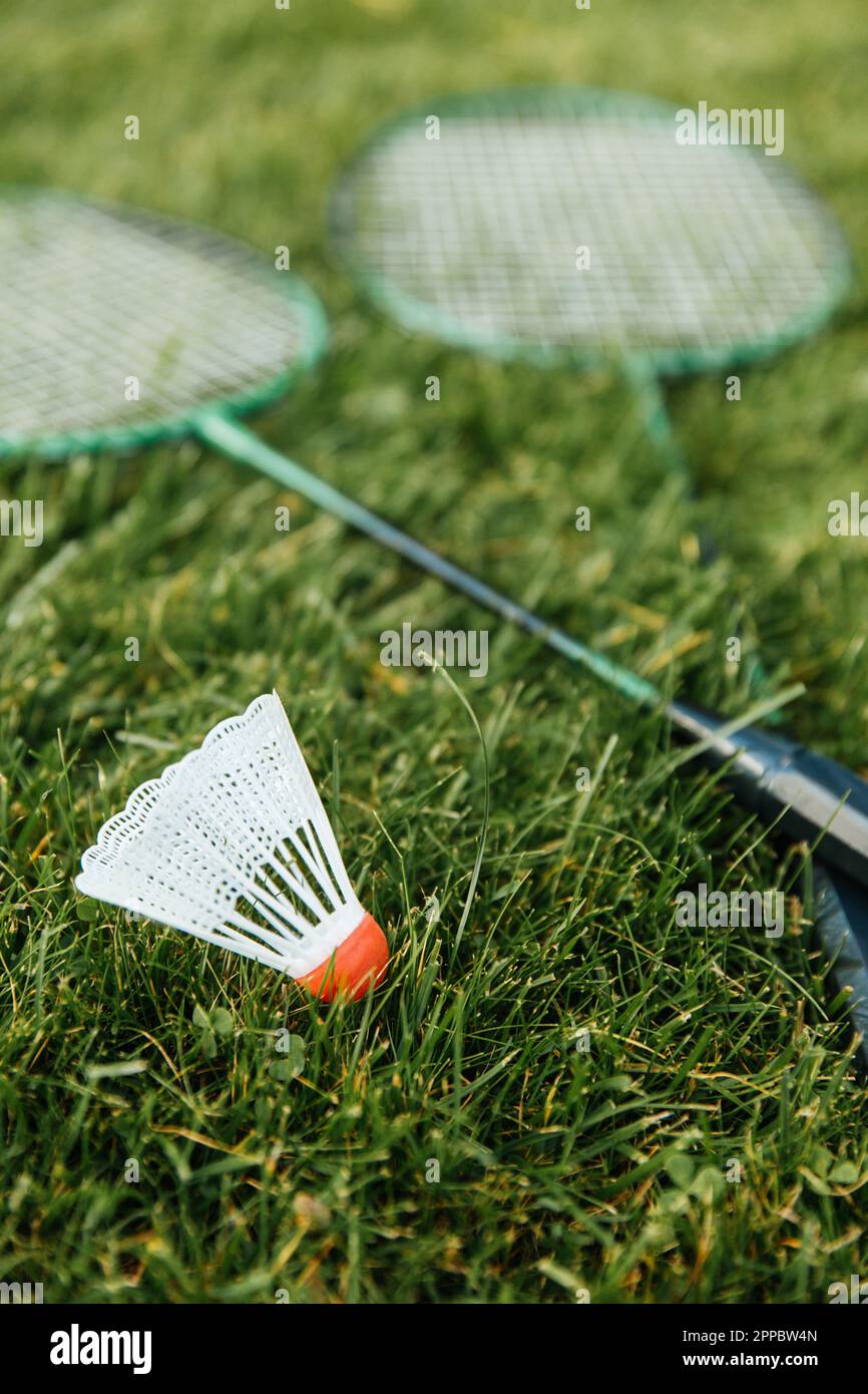 badminton rackets and shuttlecock on grass Stock Photo - Alamy