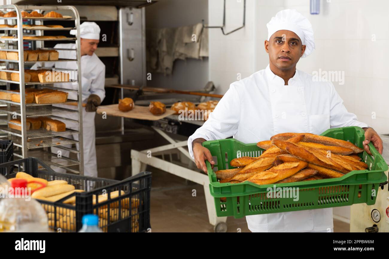 portrait of latino male baker in bakery Stock Photo - Alamy