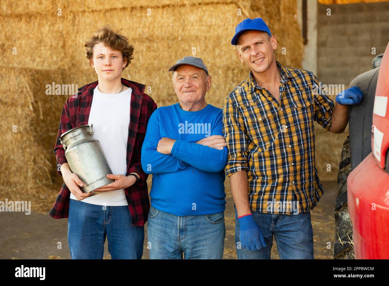 Successful elderly dairy farm owner with adult son and teen grandson ...