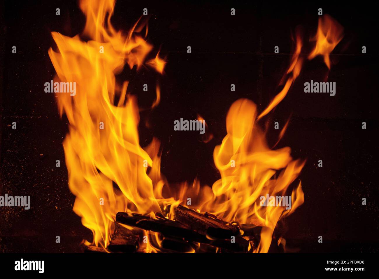glowing orange flames of fire. symbol of heat and energy Stock Photo ...