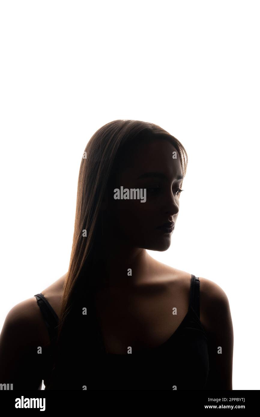 Upset woman backlit silhouette insecure woman face Stock Photo - Alamy