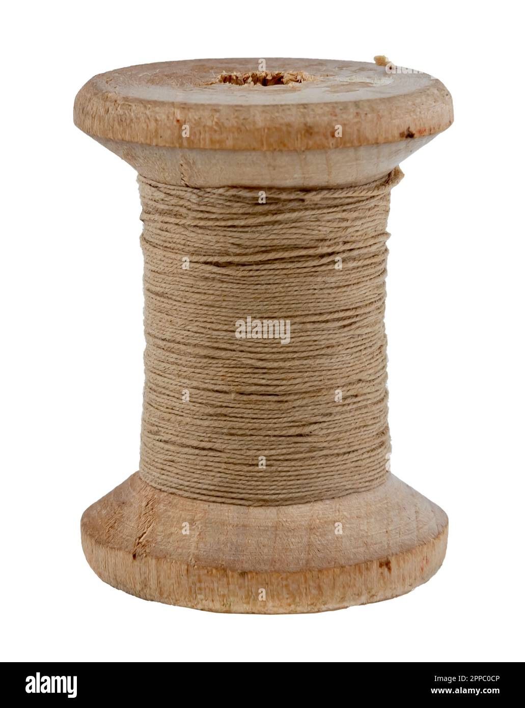 Old wooden spool of thread and needle on a white background. Sewing ...
