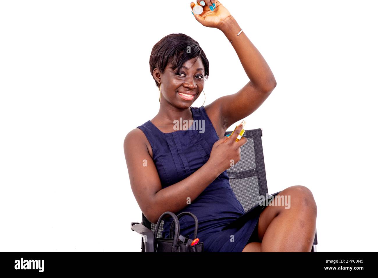 beautiful businesswoman in dress sitting on chair over white background ...