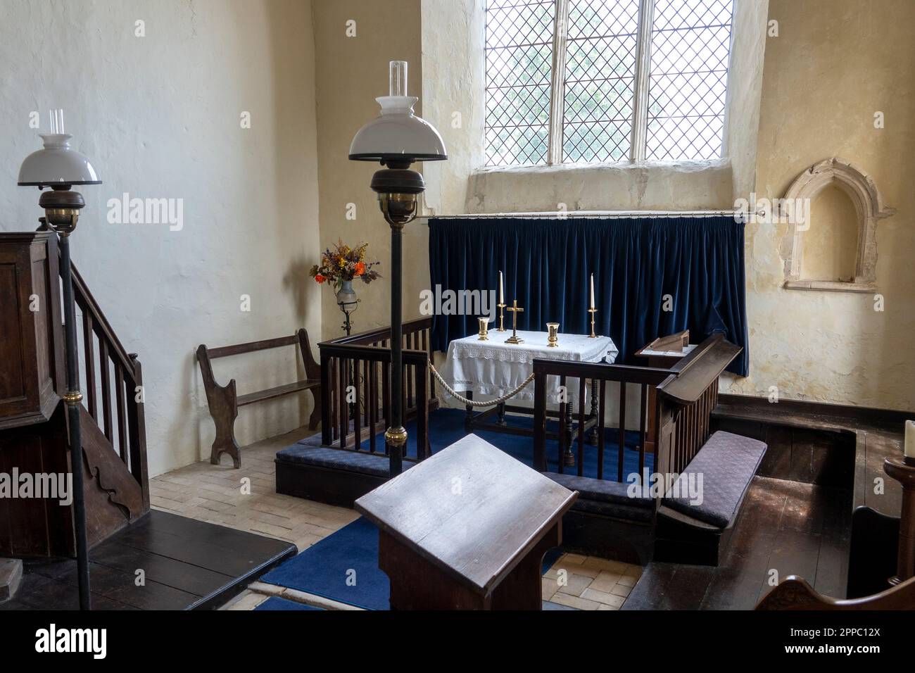The simple sanctuary and altar of St Andrew and St Eustachius Church ...