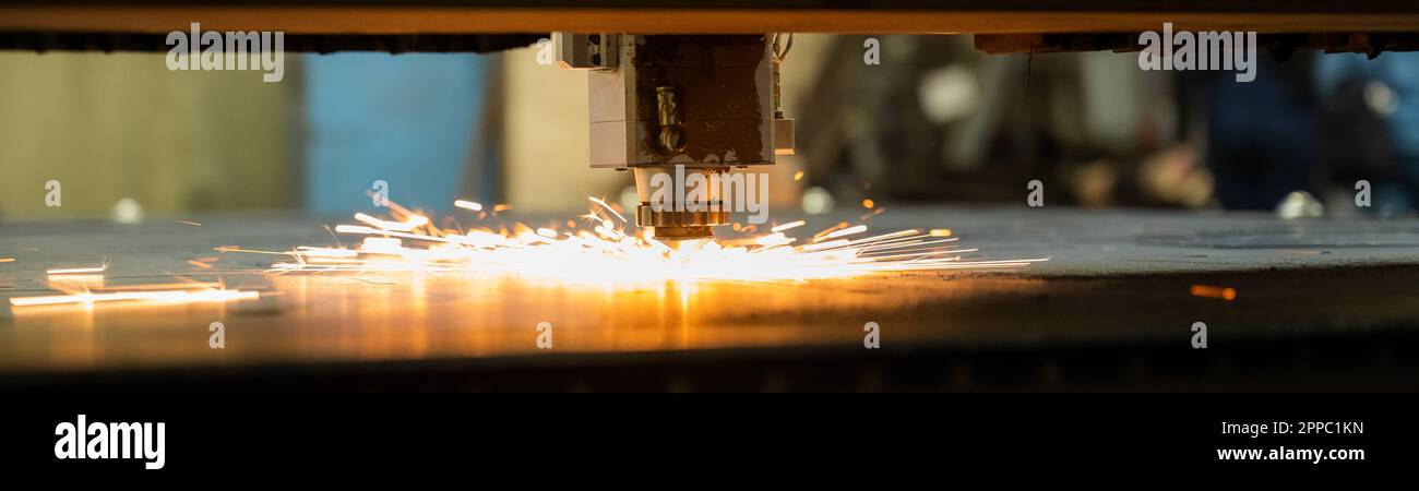 CNC machine. Laser cutting of metal. Sparks. Widescreen Stock Photo - Alamy