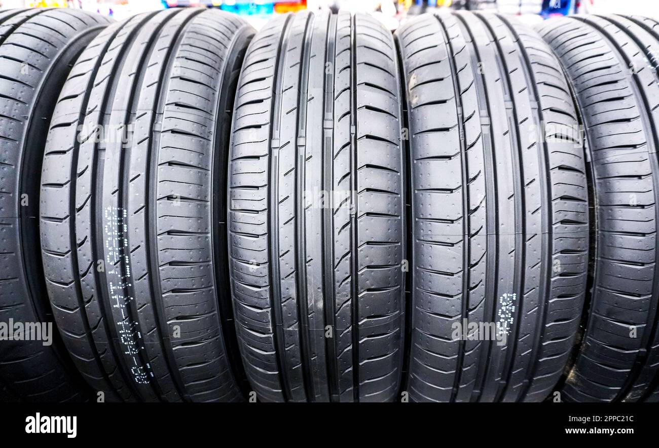 New summer tires stacked up for sale in a superstore Stock Photo - Alamy
