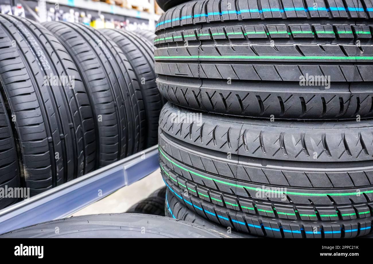 New summer tires stacked up for sale in a superstore Stock Photo - Alamy