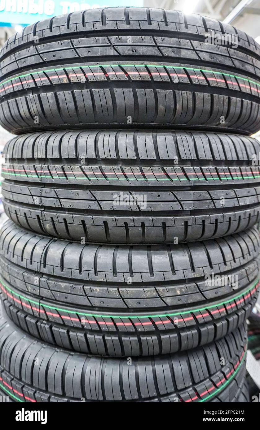 New summer tires stacked up for sale in a superstore Stock Photo - Alamy