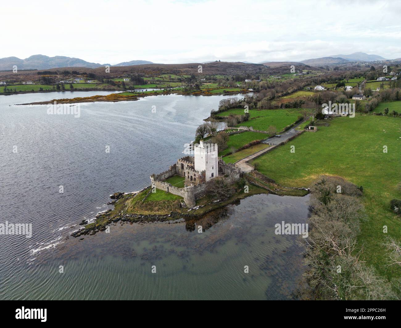 An aerial view of the Doe Castle separated with waters and lush ...