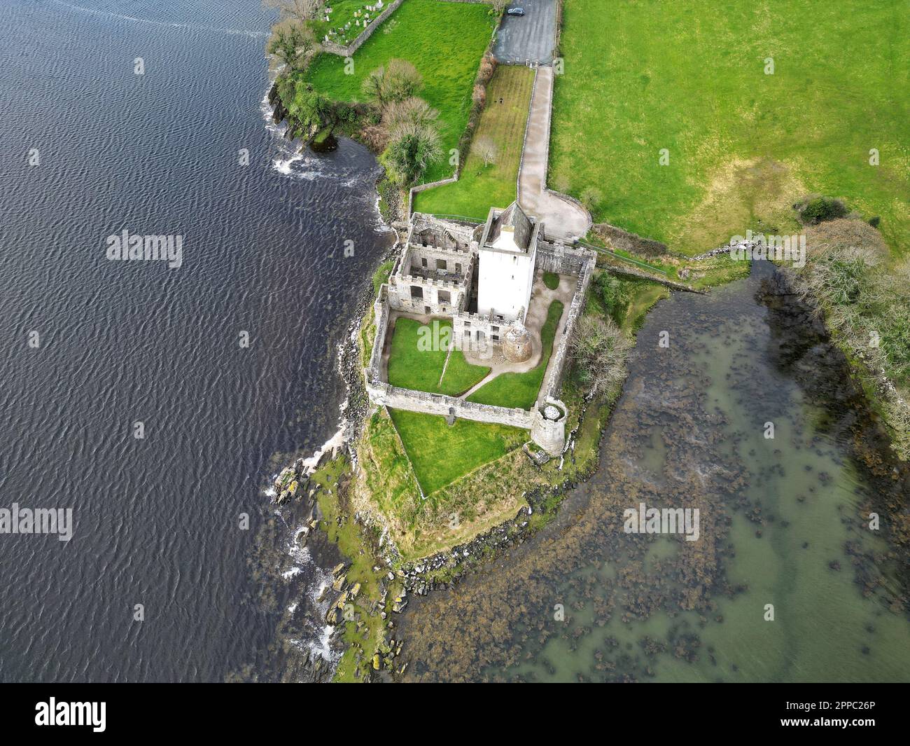 An aerial view of the Doe Castle separated with waters and lush ...