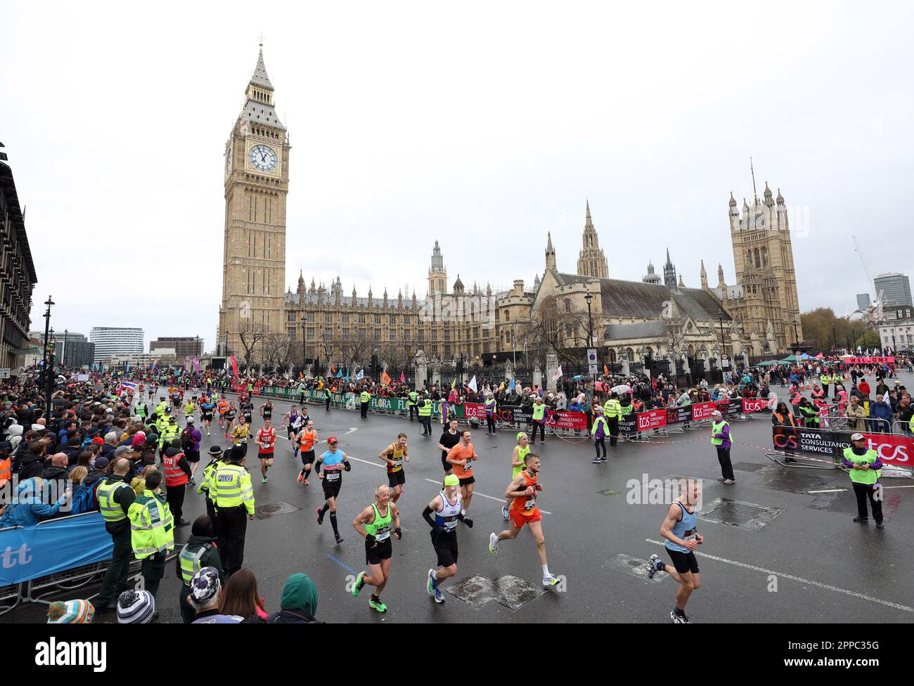 London, UK. 23rd Apr, 2023. Participants in the 2023 London Marathon run through Parliament Sq ...