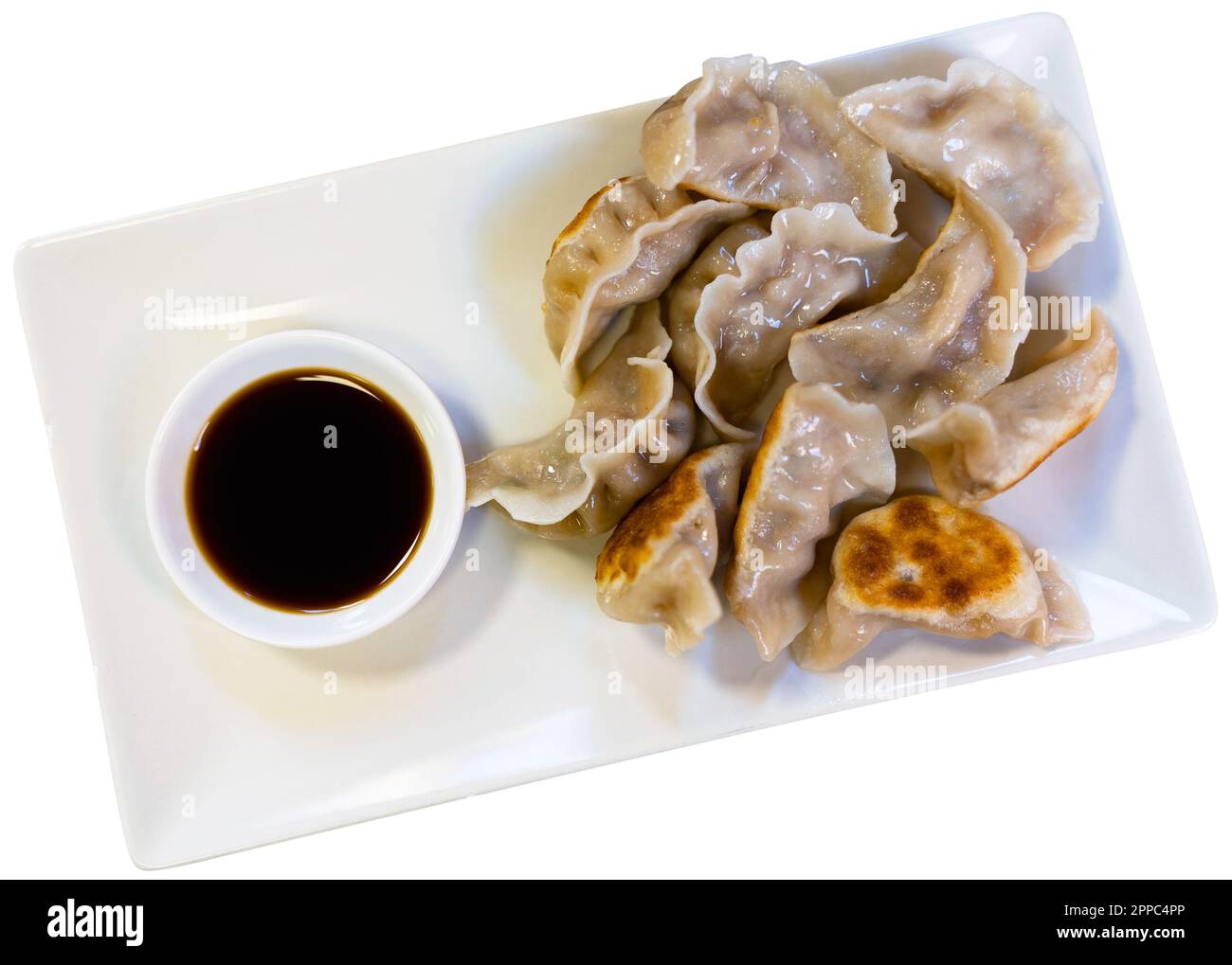 Fried Chinese dumplings served with soy sauce Stock Photo - Alamy
