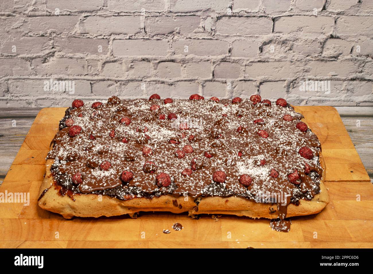 Marijuana cake with dry red currants and chocolate on arabic color ...