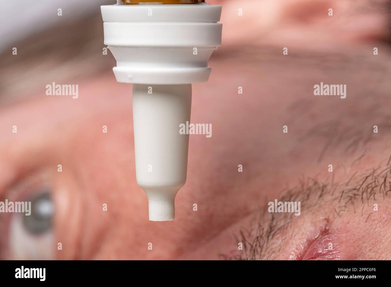 Red nose and gray beard macro photo picture with medicine white dropper ...