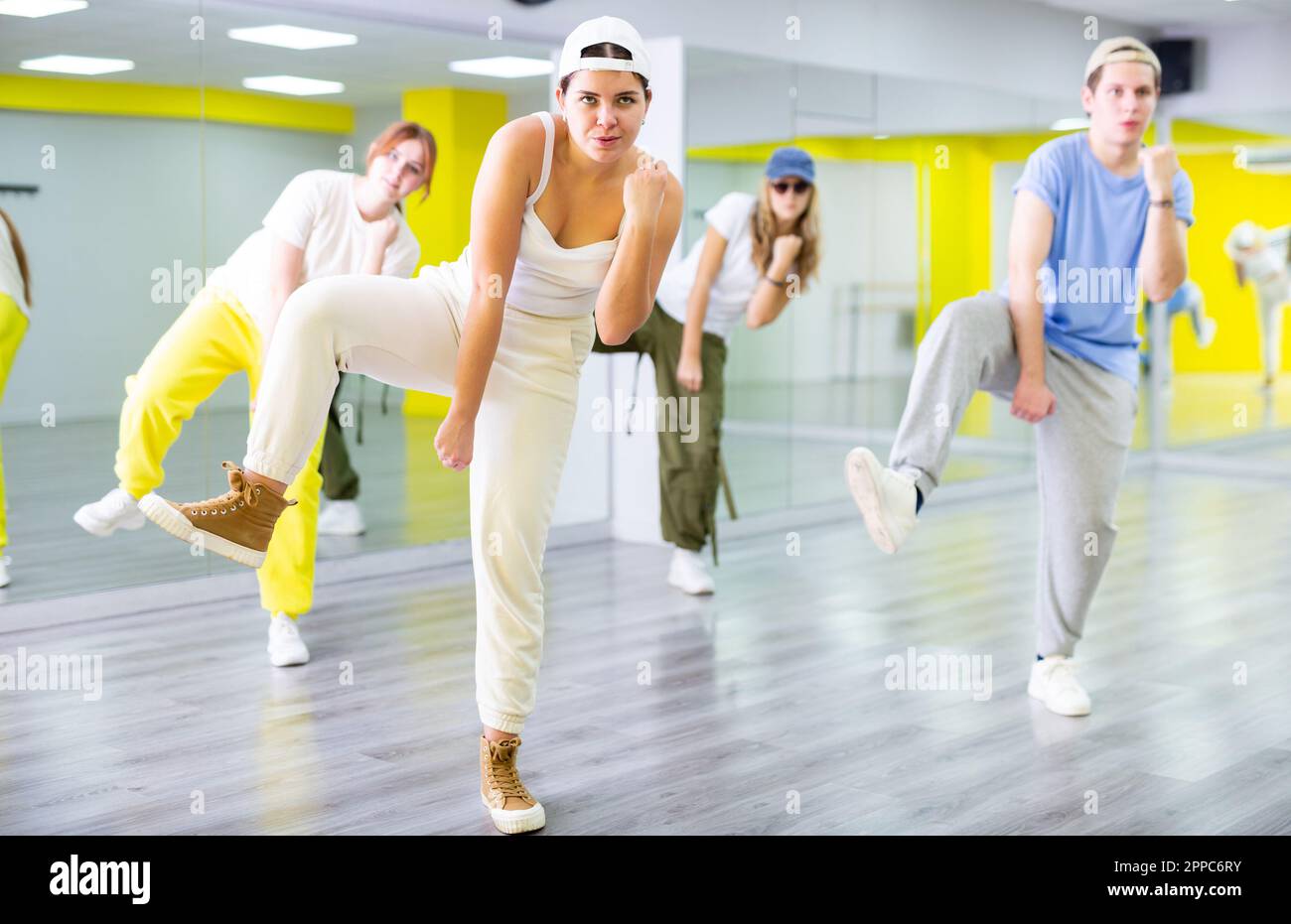 Young girl in cap dancing hip hop Stock Photo - Alamy