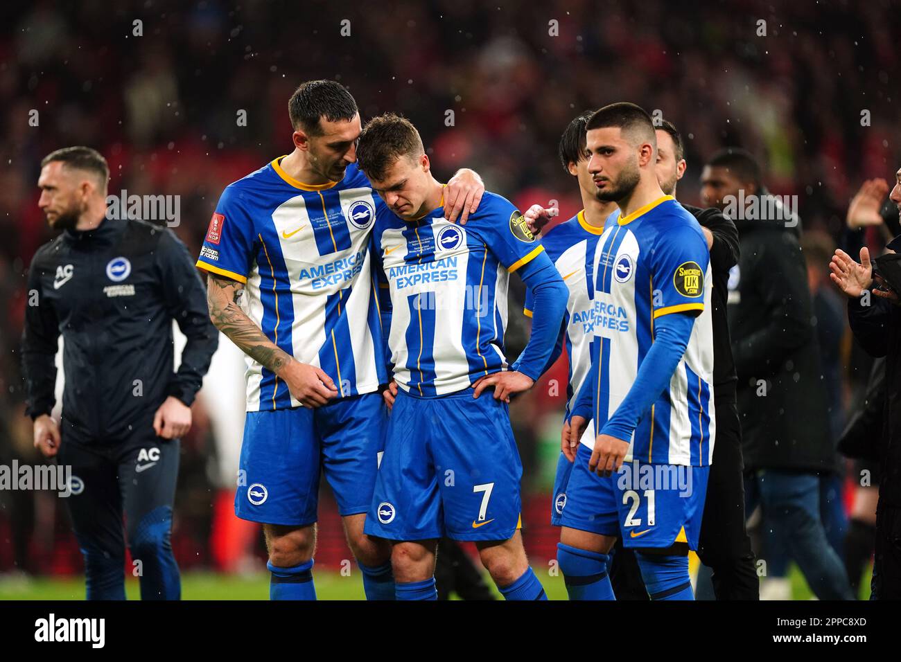 Brighton and Hove Albion's Lewis Dunk comforts Solly March after ...
