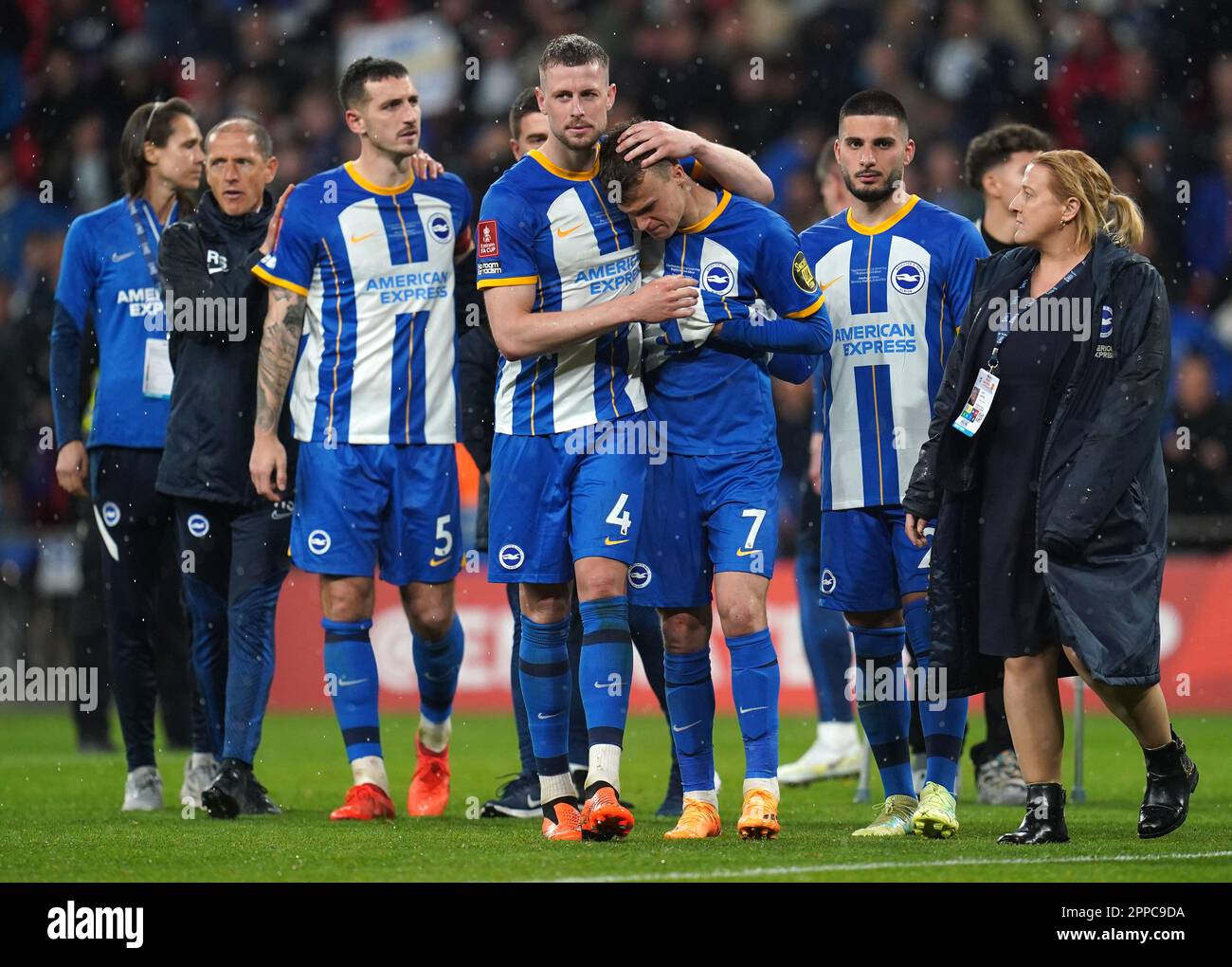 Brighton and Hove Albion's Solly March (centre) after missing a penalty ...
