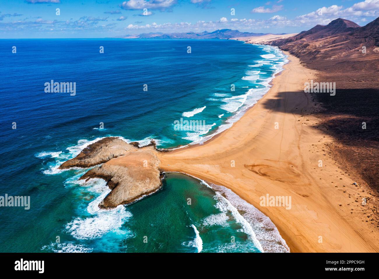 Amazing Cofete beach with endless horizon. Volcanic hills in the ...