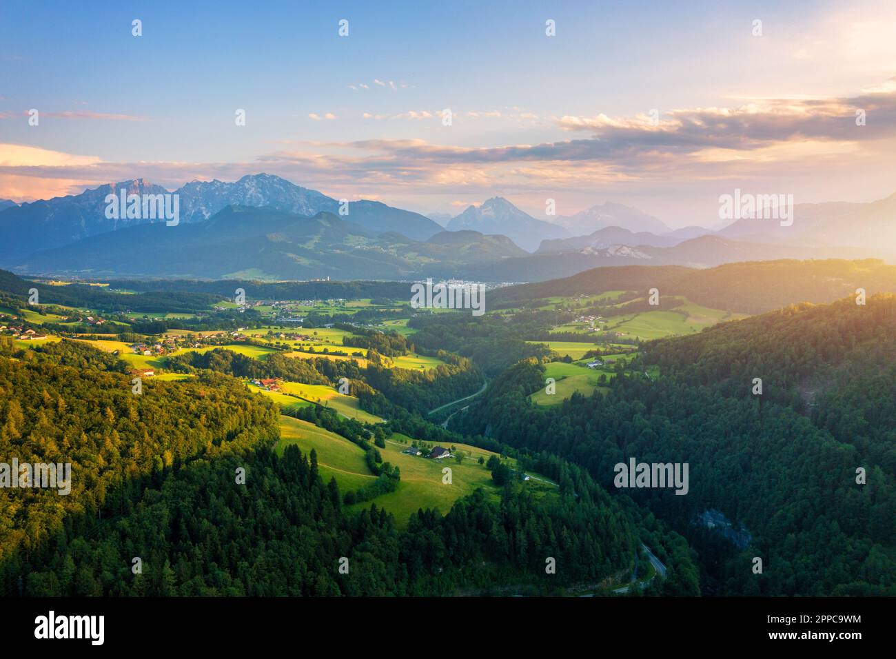Green meadows, alpine houses and mountain peaks, Salzburger area ...