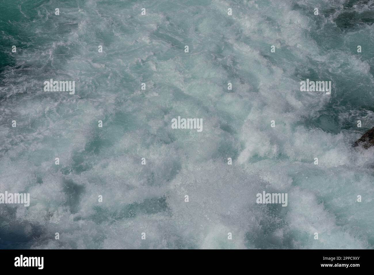 Swirling and surging river water below as the dam gates open at ...