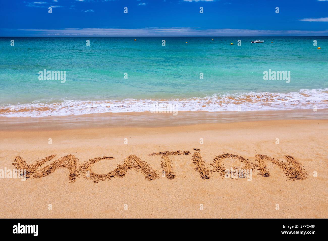 Vacation text on a beach. Vacation written in a sandy tropical beach ...