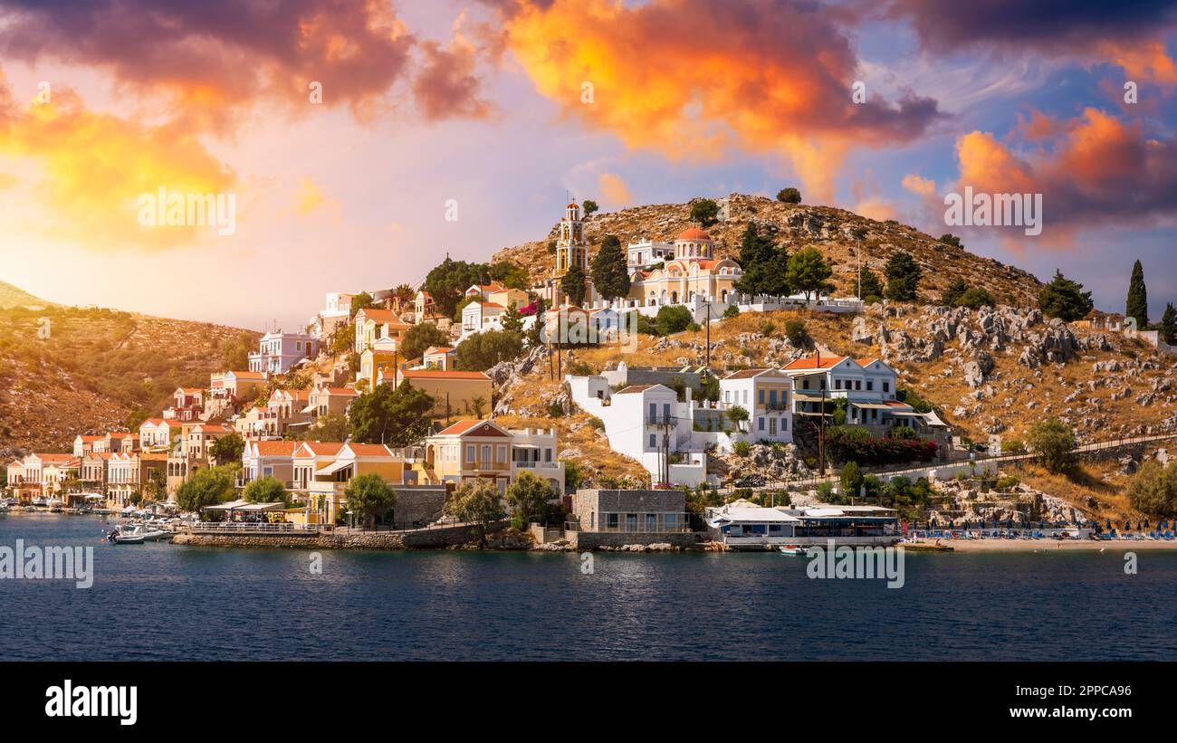 View of the beautiful greek island of Symi (Simi) with colourful houses ...