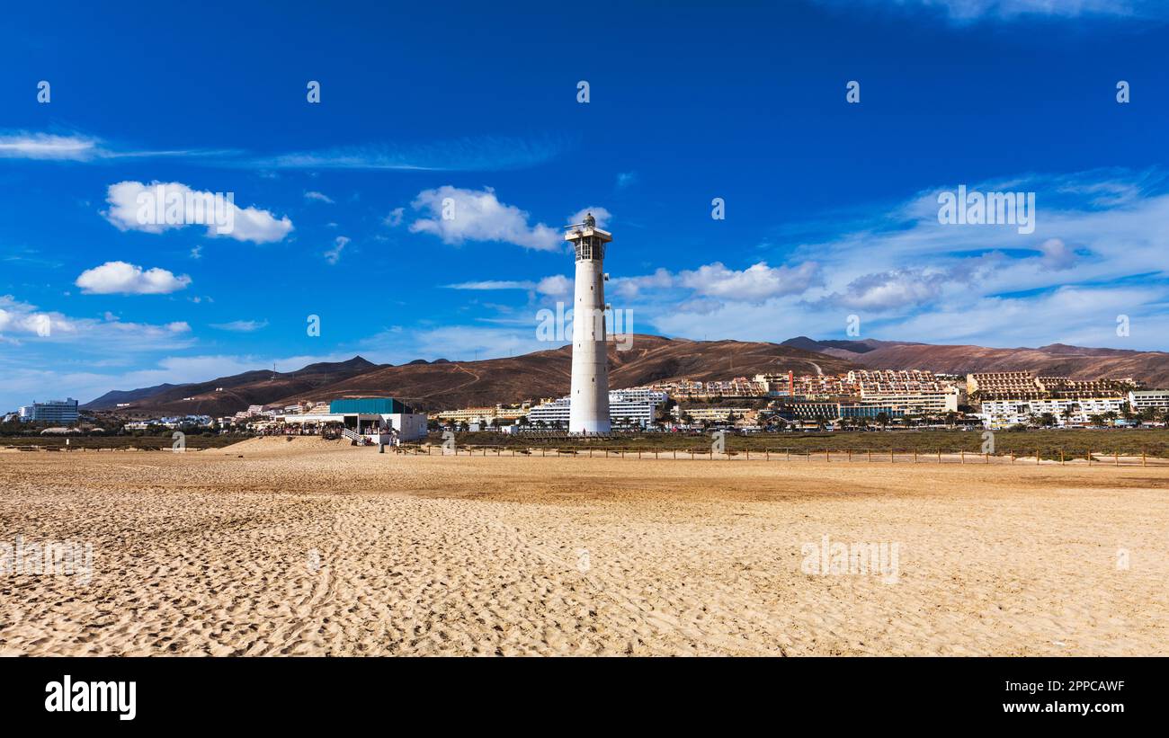 Lighthouse on Morro Jable beach on Jandia peninsula in sunrise light ...