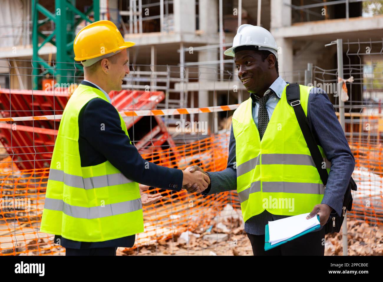 Two successful civil engineers exchange a friendly handshake Stock ...