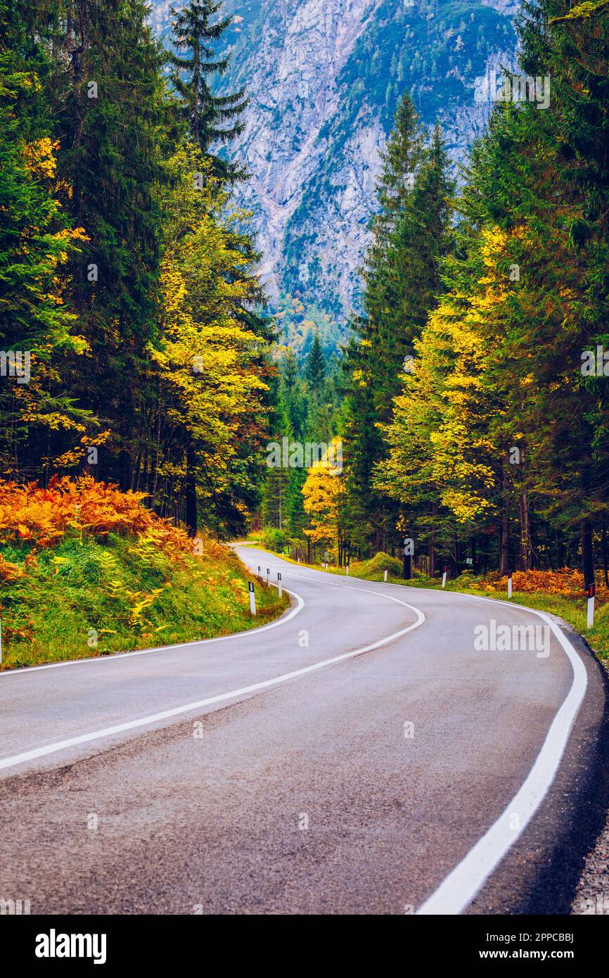Mountain road. Landscape with rocks, sunny sky with clouds and ...
