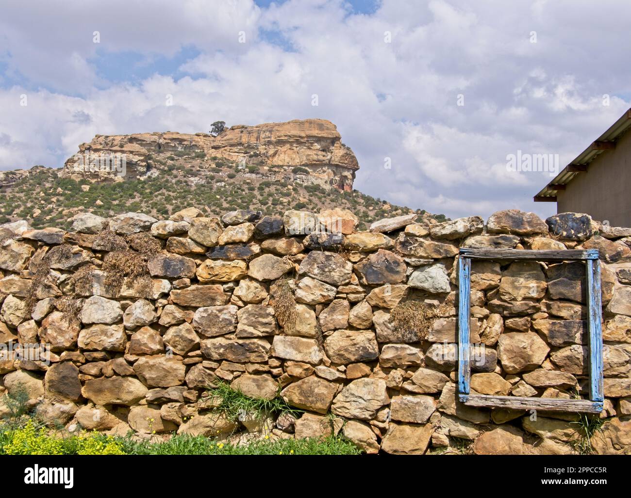 Stone wall with sandstone hill in the background on a farm in the Free ...